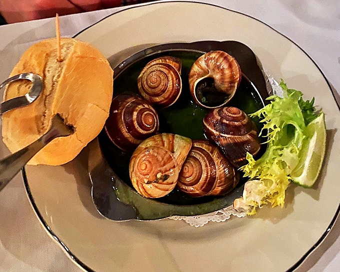 Escargot served properly in those classic shells means someone in the kitchen actually knows what they're doing here.