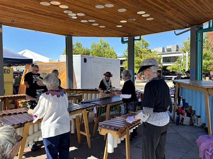 Musicians add the perfect soundtrack to market mornings, their melodies floating between stalls like invisible threads connecting the community.