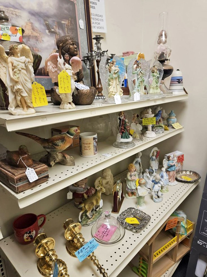 Figurines and collectibles arranged with care, each with a yellow price tag and a story to tell. Grandma's curio cabinet is calling!