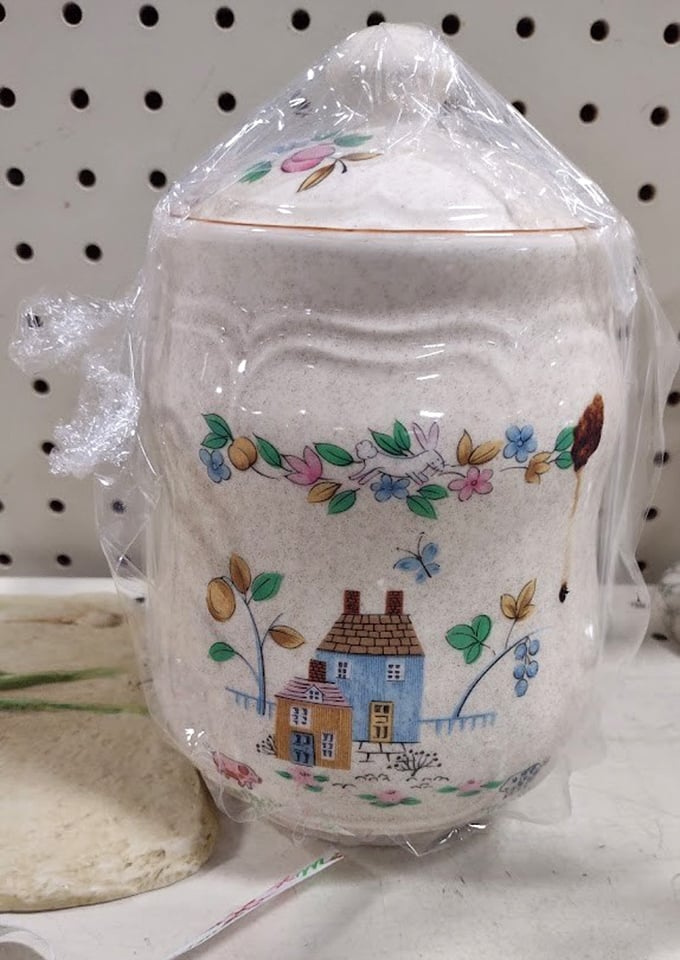 Delicate floral ceramics that survived decades of careful handling, now waiting for a new home. Grandmothers everywhere would approve of this charming preservation.