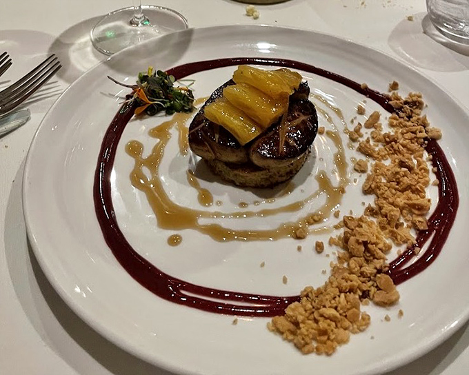 Foie gras gets the royal treatment with caramelized fruit and artistic plating. This isn't just food &ndash; it's edible theater on fine china.