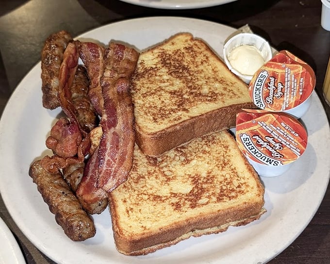 Breakfast that doesn't mess around&mdash;crispy bacon, golden French toast, and those little cups of syrup that never quite hold enough. Morning glory on a plate.