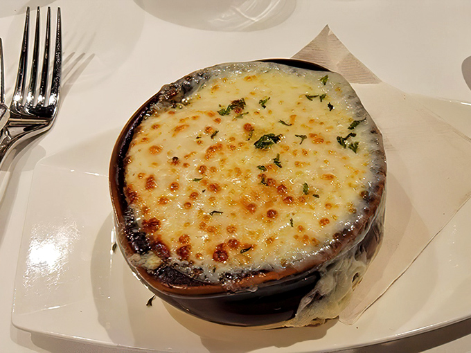 This isn't just French onion soup—it's a cheese lover's fantasy with a broth foundation. That golden, bubbling top is begging to be broken into.