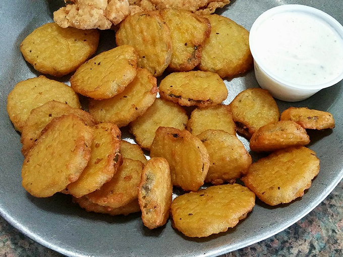 Fried pickles that deliver the perfect trifecta: crunchy exterior, tangy interior, and a dipping sauce that ties it all together like a good therapist.