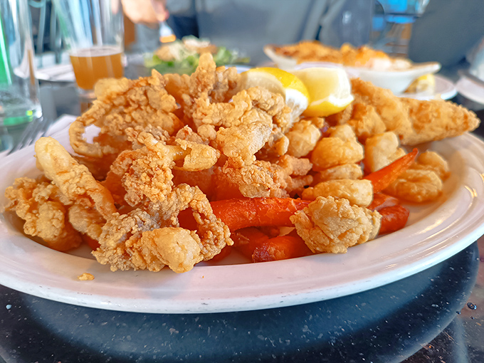 These fried whole belly clams aren't just appetizers; they're little golden nuggets of the sea that crunch like ocean memories.