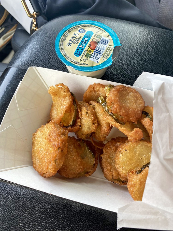 Fried pickles that achieve the impossible: maintaining their crunch while delivering that perfect tangy-salty punch to your taste buds.