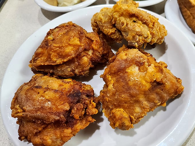 Fried chicken that's audibly crunchy just looking at it&mdash;golden-brown pieces with seasoning that's traveled through generations of kitchen wisdom.