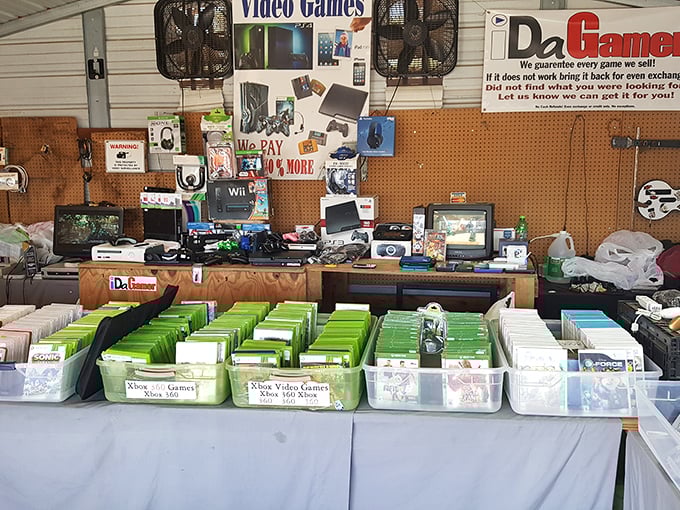 Video game heaven for nostalgic Gen-Xers! This stall holds more childhood memories than your parents' attic, organized with surprisingly professional retail precision.