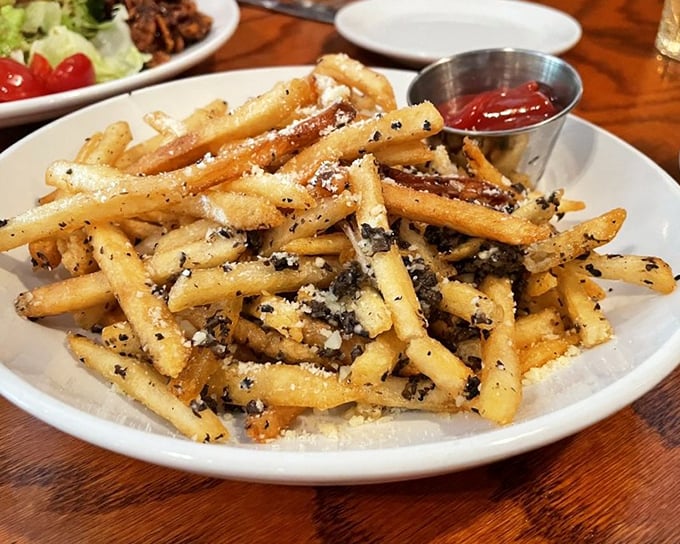 These aren't ordinary fries&mdash;they're garlic truffle fries that have gone to graduate school and returned with a PhD in flavor.