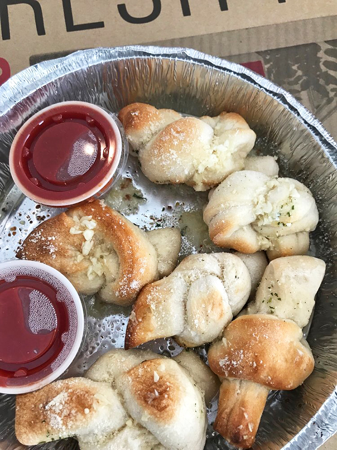 Garlic knots so buttery and aromatic, they could probably be detected from space by hungry astronauts with good taste.