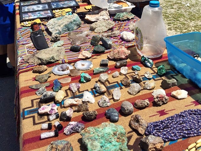 Earth's treasures laid bare on a southwestern-patterned cloth. Each crystal and geode holds millions of years of planetary secrets.