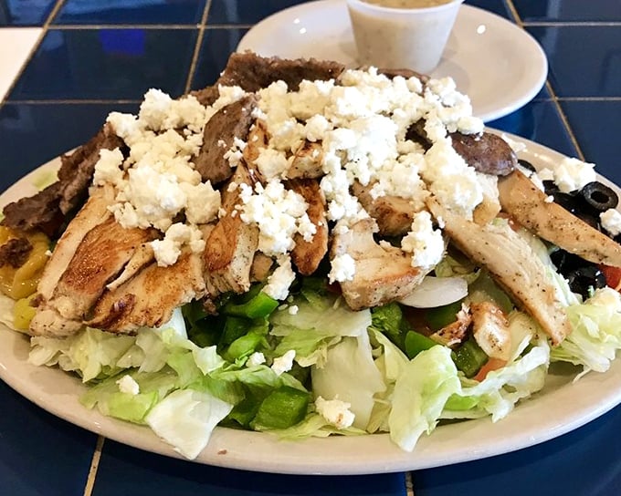A Greek salad that transports you to the Mediterranean without leaving Toledo. Feta crumbles generously over grilled chicken and crisp vegetables like edible confetti.