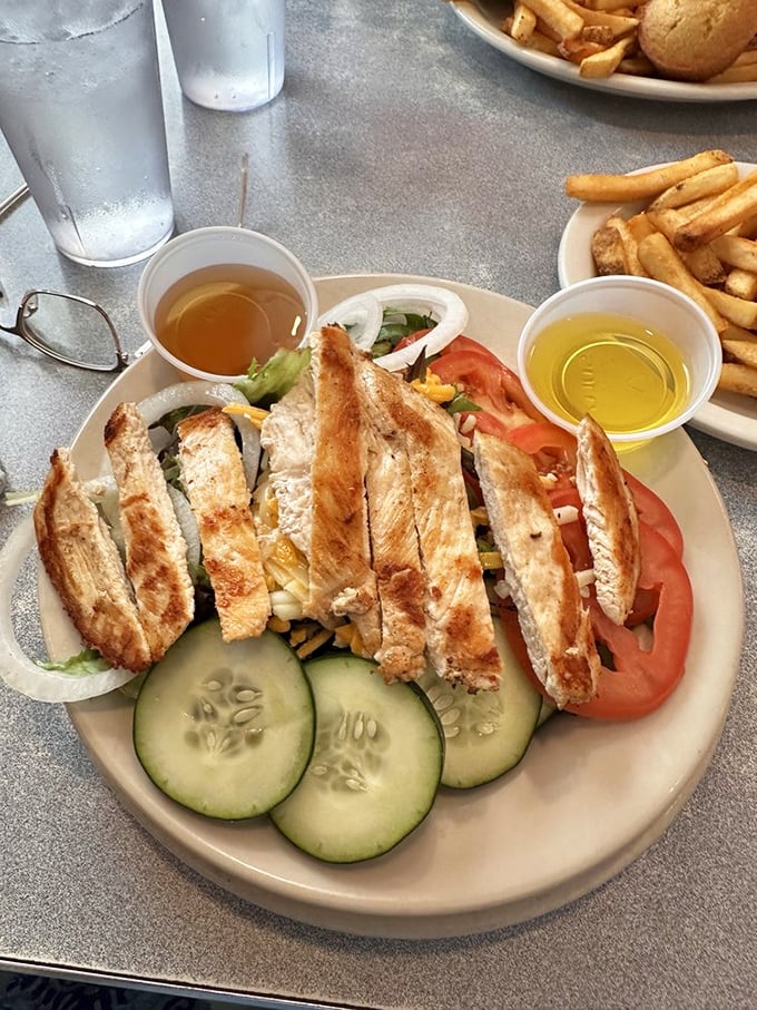 A grilled chicken salad for those who want to pretend they're being healthy while still enjoying the diner experience. Nice try!