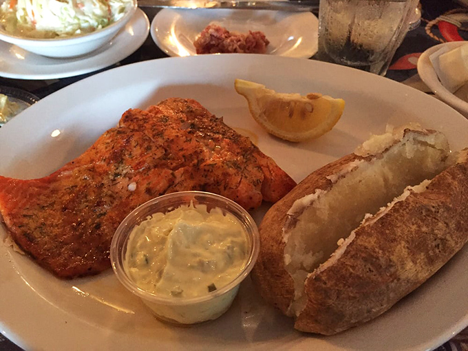 Grilled salmon with a gorgeous char that proves you don't need an ocean view for spectacular seafood experiences.