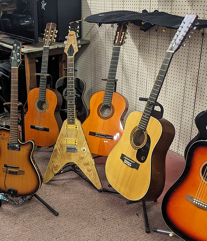 Guitar row – where every instrument has a story, and at least one has definitely been played at a Michigan basement party.