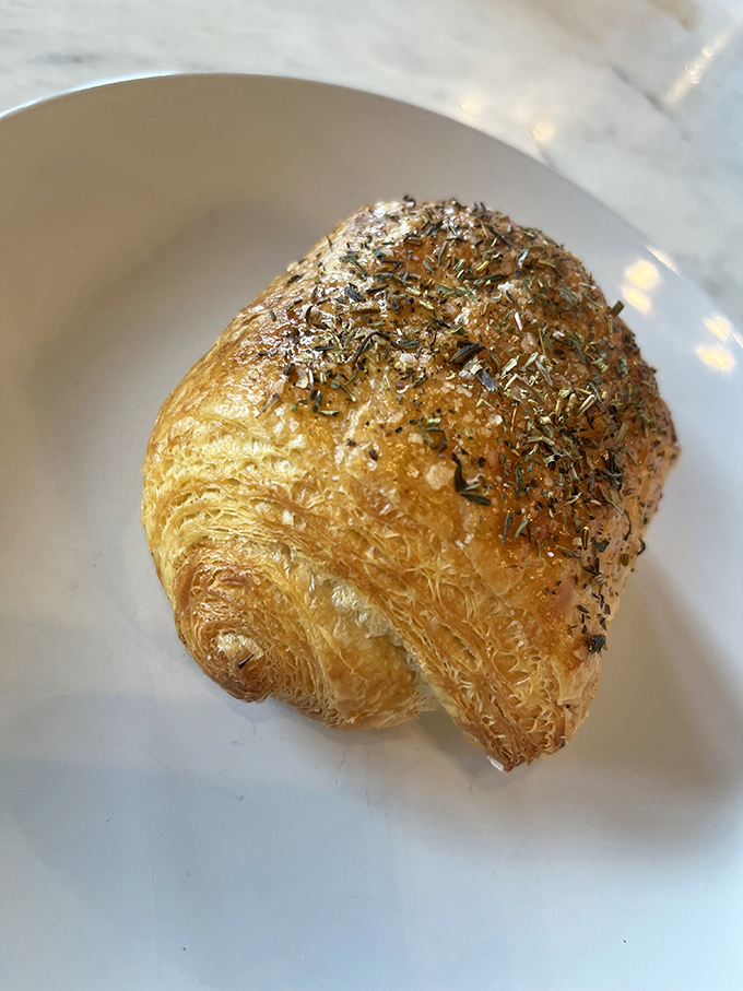 A savory croissant with herbs that would make an excellent breakfast, lunch, or "it's 3 PM and I deserve this" snack.