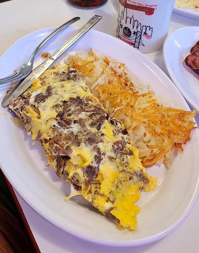 This isn't just breakfast—it's a masterclass in how hash browns and cheese can transform a morning from mundane to magnificent in just one bite.