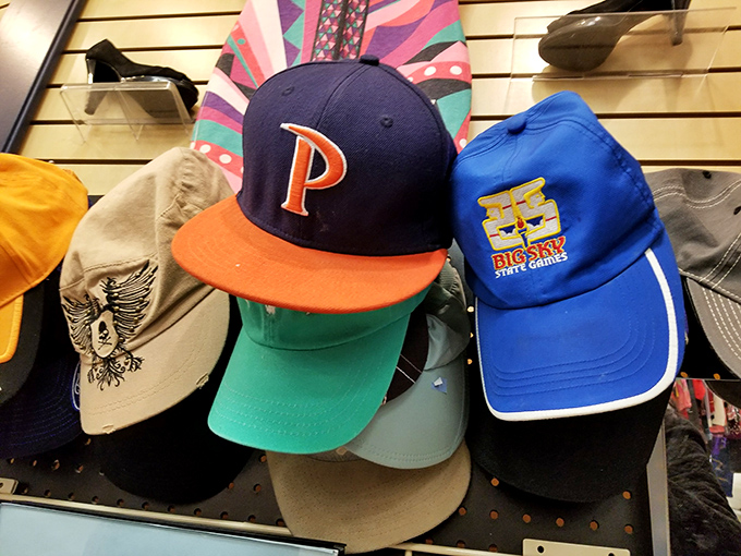 The hat section&mdash;where baseball loyalties, vacation memories, and sun protection meet. That Big Sky cap has probably seen more mountain views than most postcards.
