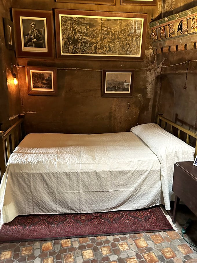 Spartan bedroom proves even castle-builders need to sleep sometimes. The walls may be concrete, but that bed looks surprisingly inviting.