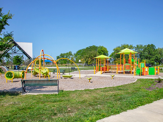Heritage Trail Park's playground equipment creates a colorful oasis where energy-filled children can finally run wild.