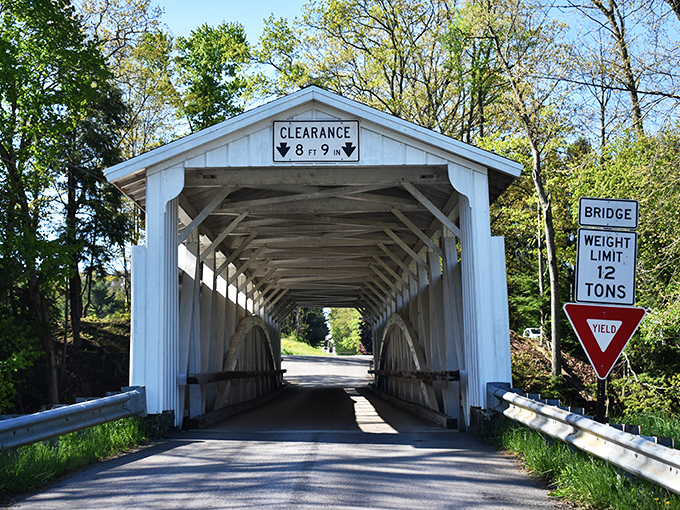 The historic covered bridge&mdash;architectural poetry in white wood. Crossing this feels like stepping into a simpler time, when food came from neighbors, not apps.