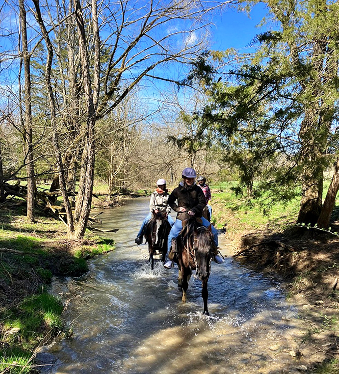 These riders aren't just crossing a stream&mdash;they're wading through centuries of Kentucky tradition where horsemanship remains an everyday art form.