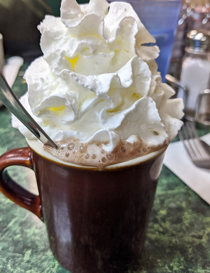 Hot chocolate crowned with whipped cream royalty &ndash; because sometimes coffee needs a day off.
