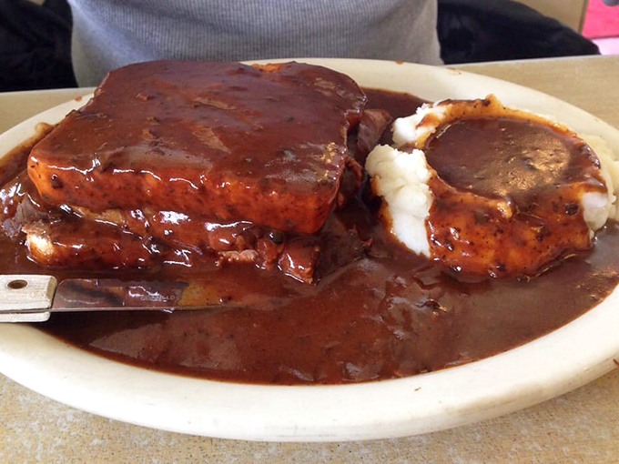 Hot roast beef swimming in gravy with mashed potatoes standing like islands of comfort. The kind of meal that makes you want to hug the cook.