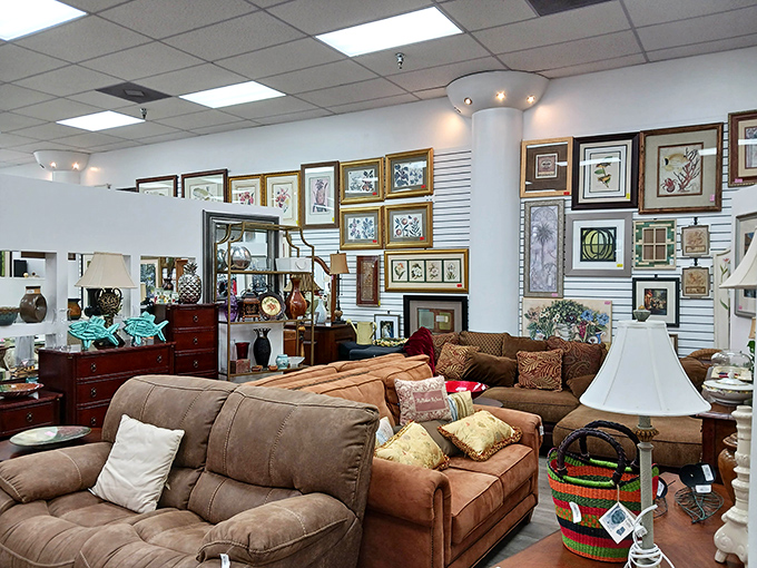 An impressive gallery wall serves as backdrop to quality furniture finds&mdash;proof that secondhand shopping can yield first-class home decor results.