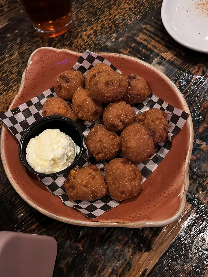 Hush puppies that don't need to be quiet about how delicious they are. Golden-fried cornmeal treasures served with a side of creamy dipping sauce&mdash;irresistible!