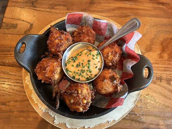 Hush puppies so good they'd make a Southerner weep with joy. Crispy outside, fluffy inside, with a dipping sauce worth bottling.
