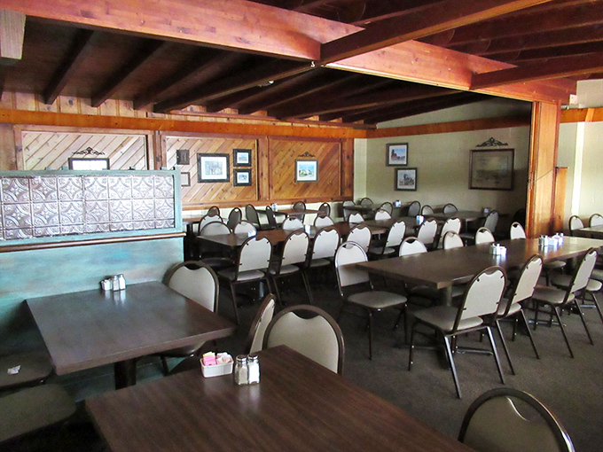 Wood beams overhead, simple tables below, and decades of happy conversations lingering in between. This room has hosted more celebrations than a calendar factory.