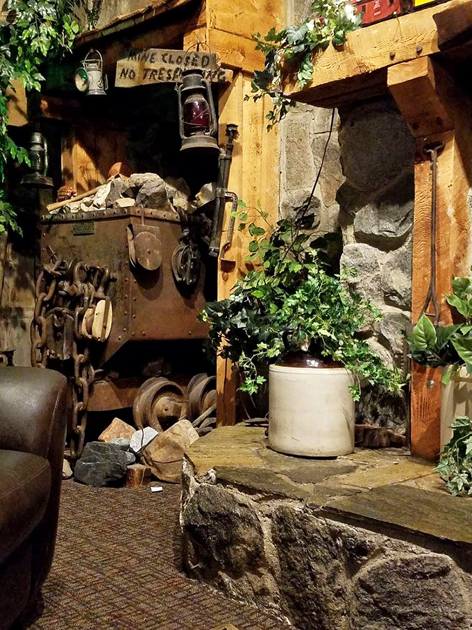 Mining equipment meets greenery in this corner of Timbermine, where "Mine Closed" signs and vintage machinery create dining ambiance you can't manufacture.