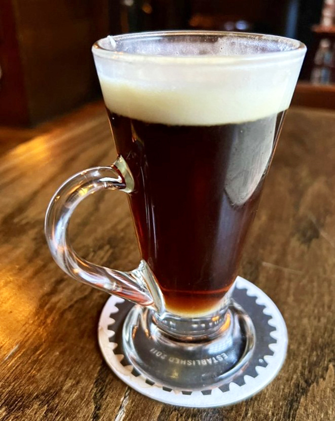 The perfect Irish coffee arrives like a warm hug in a glass, with cream floating like clouds over rich coffee.