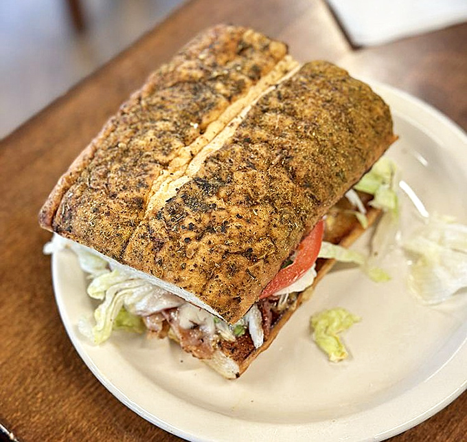 This sandwich isn't just stacked—it's architecturally sound. The bread has the perfect ratio of crunch to give.