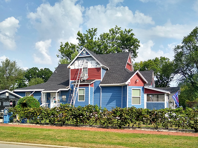Talk about curb appeal! This colorful house breaks all the rules with its patriotic palette and abundant greenery&mdash;small-town character personified.
