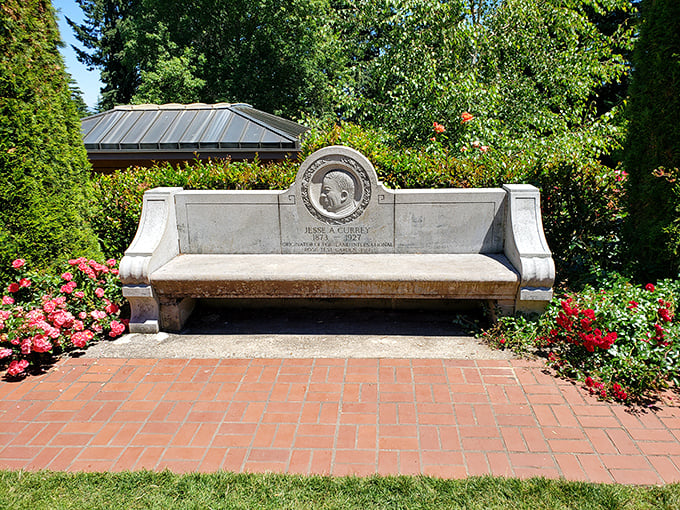 A moment of reflection carved in stone. This memorial bench offers both historical perspective and a welcome rest for weary feet.