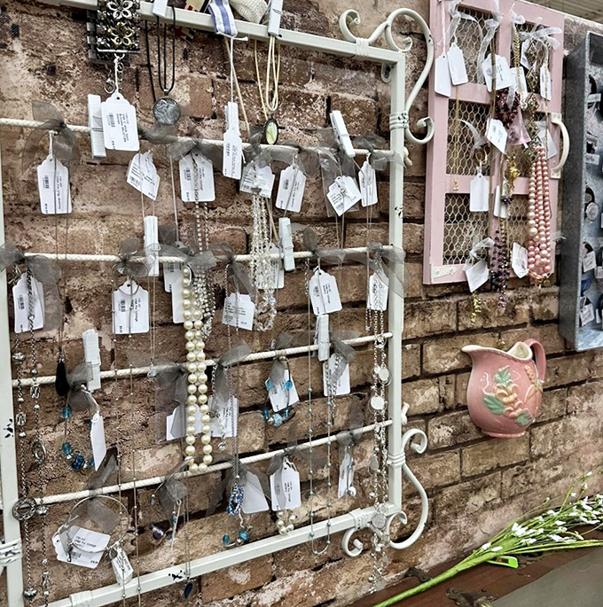 A treasure trove of jewelry displayed against exposed brick. Someone's grandmother's pearls might become your new statement piece.