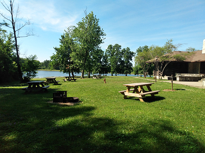 These picnic tables by the lake offer front-row dining where the only reservation needed is the one you make with yourself to slow down.