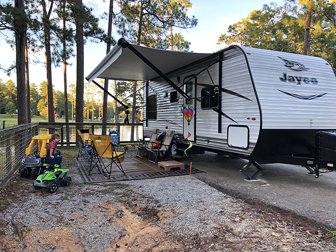 RV camping elevated to an art form. This lakeside setup isn't just a campsite&mdash;it's a temporary neighborhood with nature as your best neighbor.
