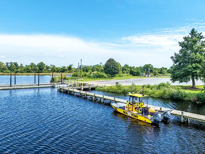 Lawson Creek Park's tranquil waters offer respite from modern chaos, where even the rescue boats seem to be taking a well-deserved break.