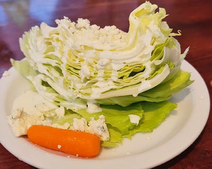 A lettuce wedge that stands tall and proud, like the iceberg version of Mount Rushmore, waiting for you to conquer it.
