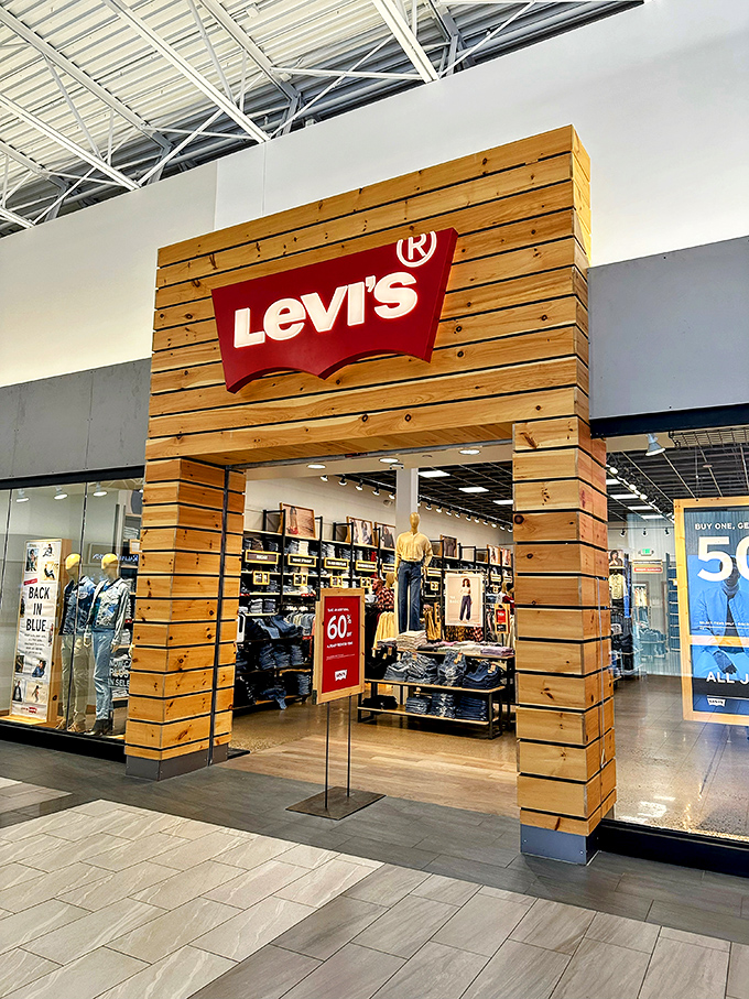 Levi's wooden facade promises denim democracy – quality jeans without the boutique price shock.
