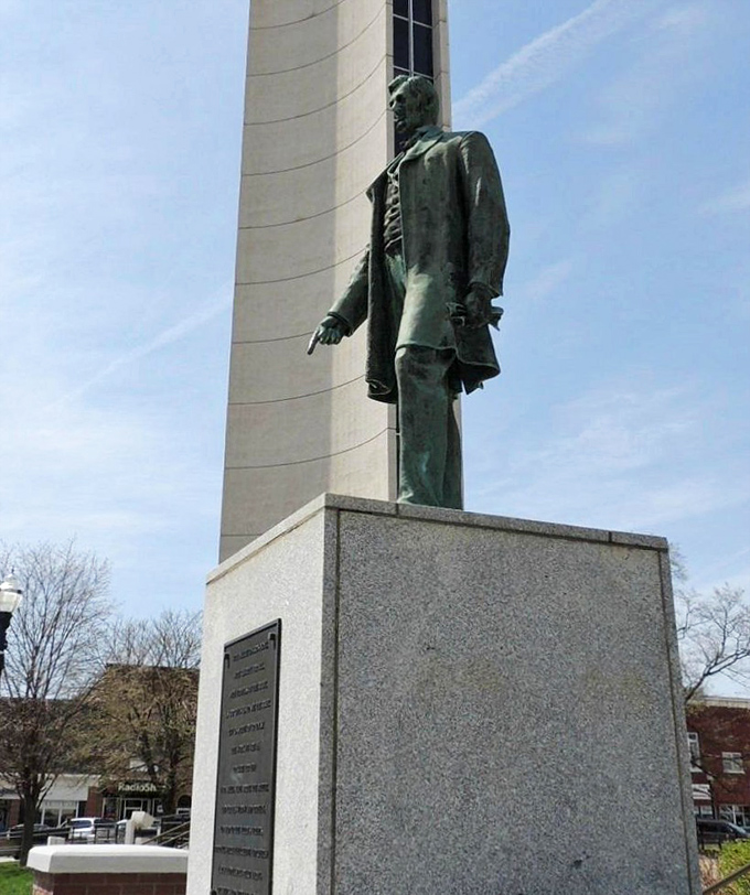 This bronze statue stands sentinel near the bell tower, a dignified reminder of the historical figures who shaped both the nation and this corner of Iowa.