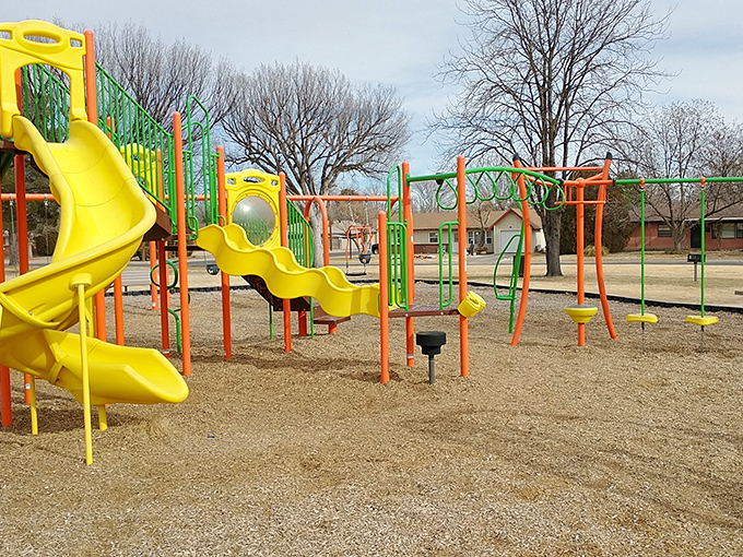 Linda Vista Park's colorful playground equipment stands ready for young visitors, offering affordable family fun that's truly out of this world.