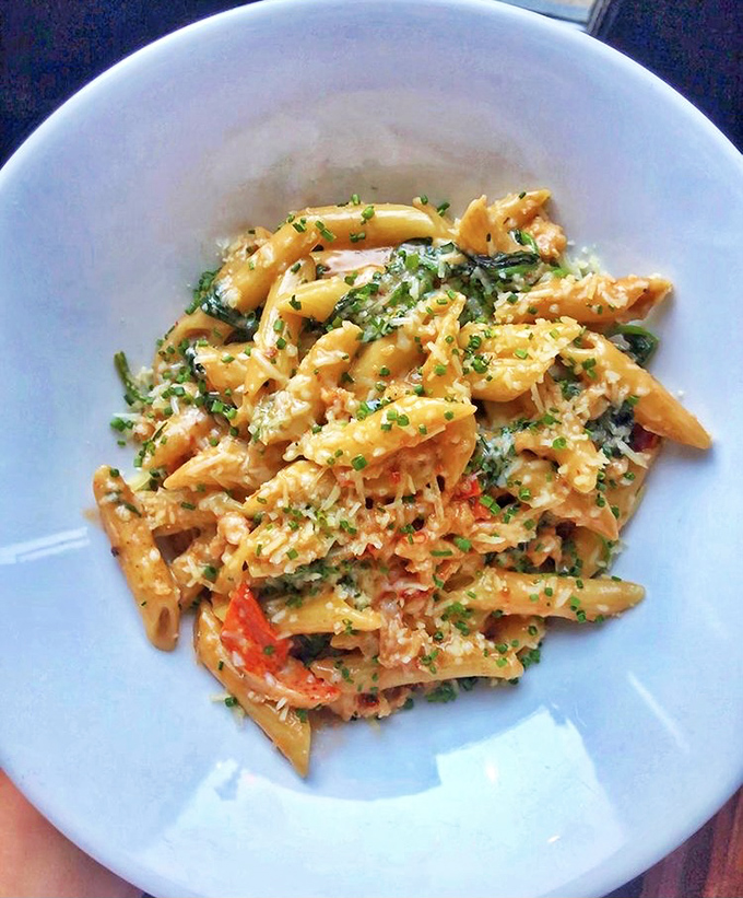 Not your college dorm pasta! Lobster-studded penne that makes you wonder why you ever settled for the boxed stuff. Pure comfort elevated.