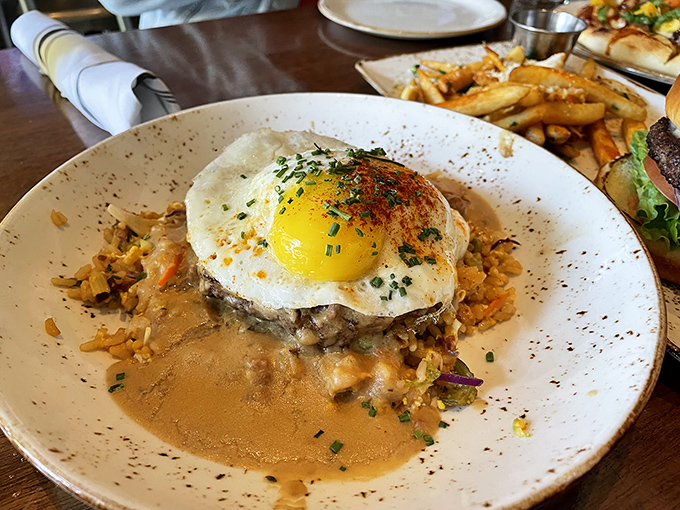 The legendary Loco Moco &ndash; comfort food that puts your grandmother's best dish on notice. That sunny-side-up egg is just waiting to create the perfect sauce.