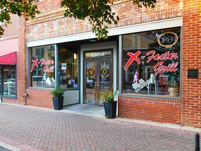 X-Factor Grill's neon sign glows with the promise of meals that locals recommend in hushed tones, as if sharing a valuable secret.