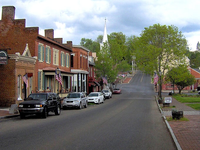 Main Street rises gently toward a church steeple, creating the kind of postcard-perfect scene that makes you slow down and appreciate small-town America.