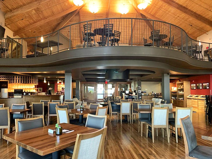 The soaring tasting room combines rustic wood beams with modern comfort for sophisticated wine experiences.